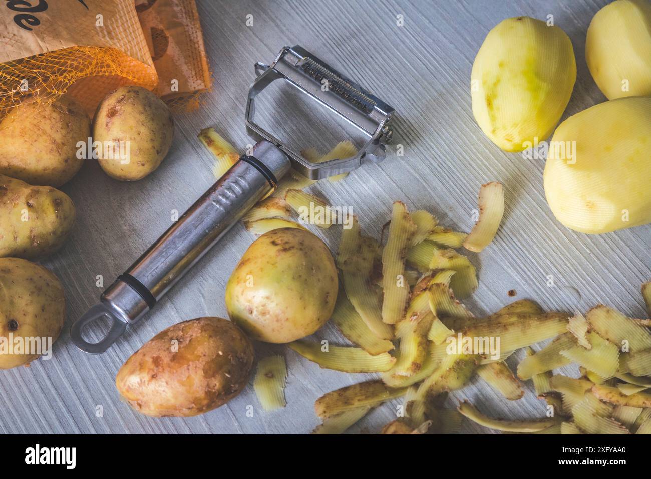 preparation phase of a potato-based recipe, peel the potatoes with the ...