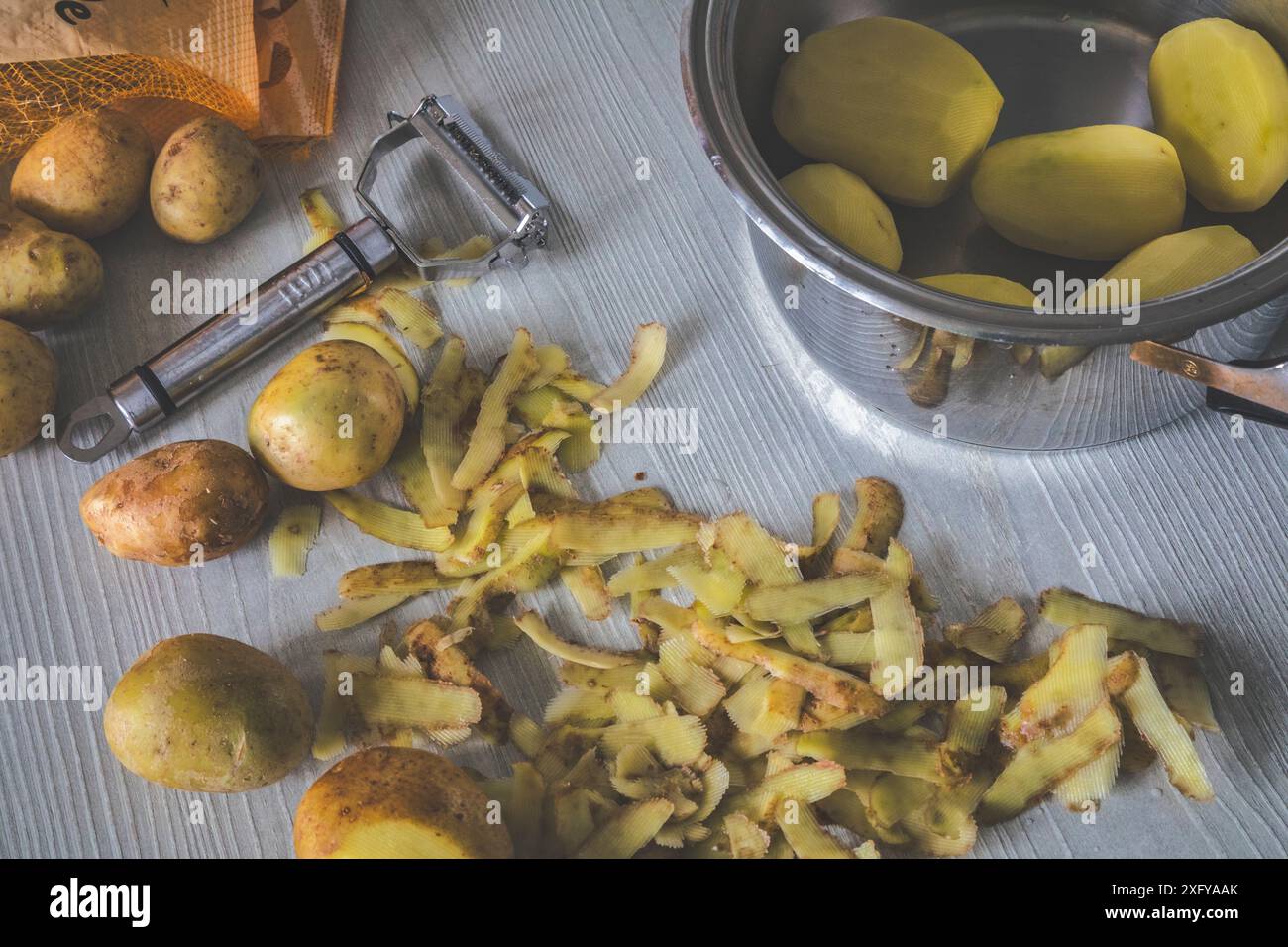 preparation phase of a potato-based recipe, peel the potatoes with the ...