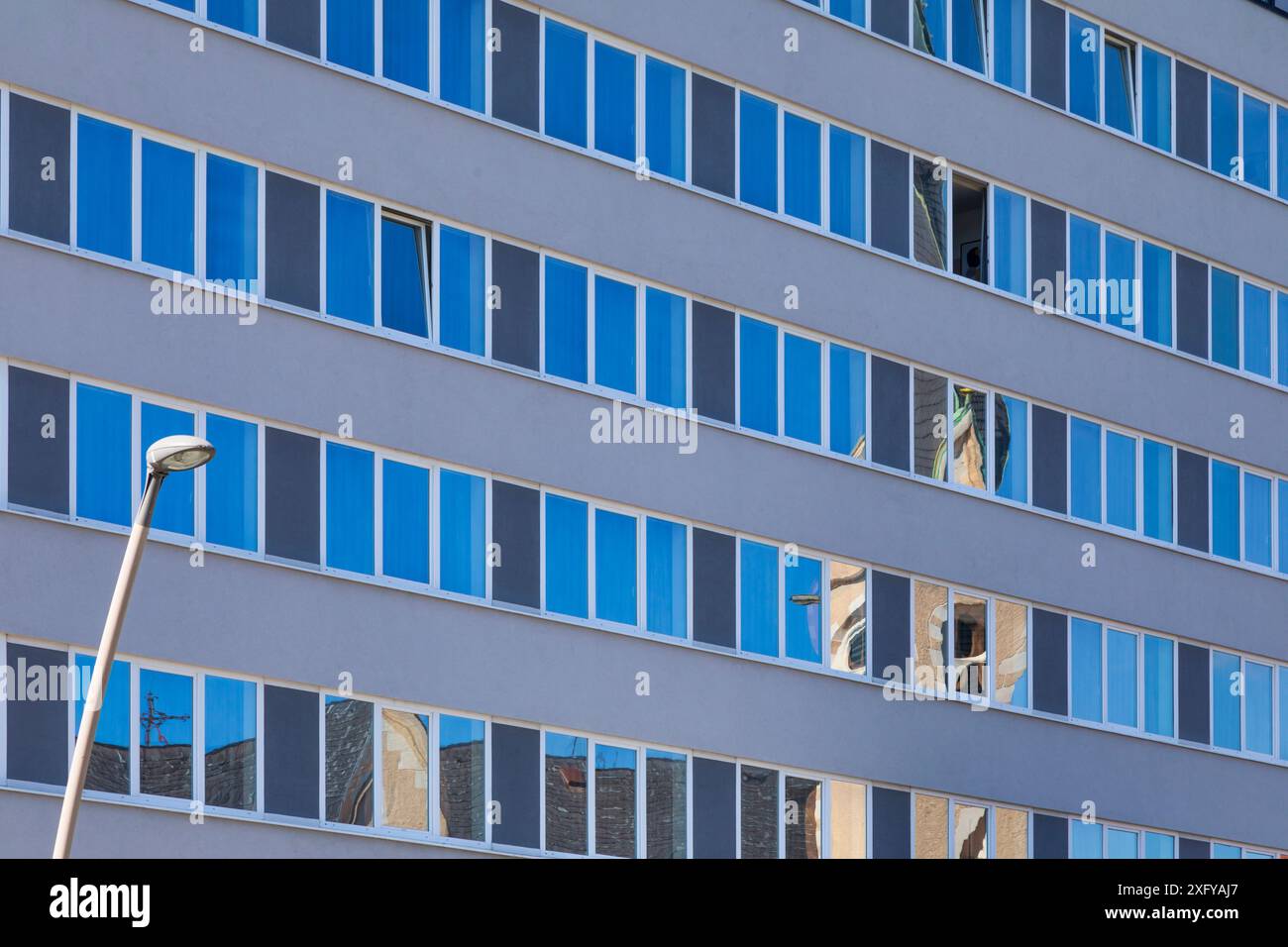 the bell tower of the church of St. Nicholas / St. Nikolai reflected in ...