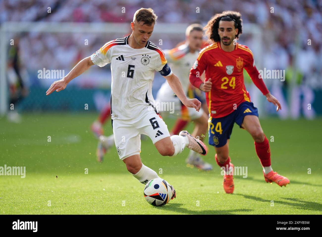 Germany's Joshua Kimmich in action against Spain’s Marc Cucurella ...
