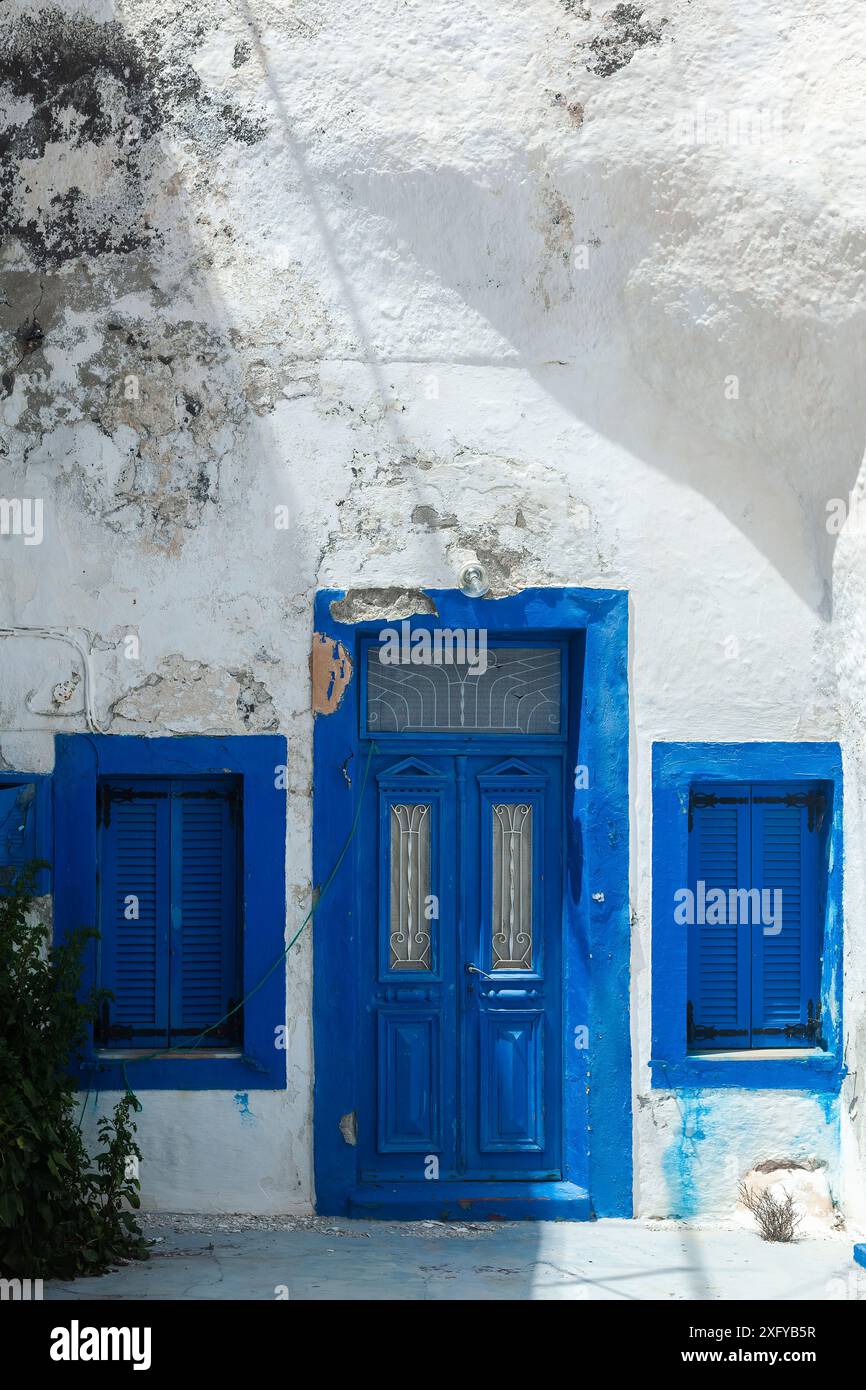 Rustic blue and white house on Thirasia island, Greece, exemplifying ...