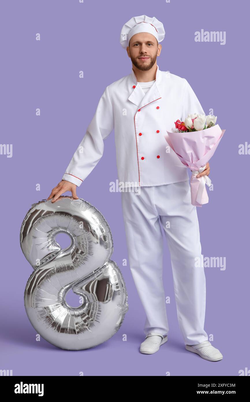 Young male chef with balloon in shape of figure 8 and flowers on lilac ...