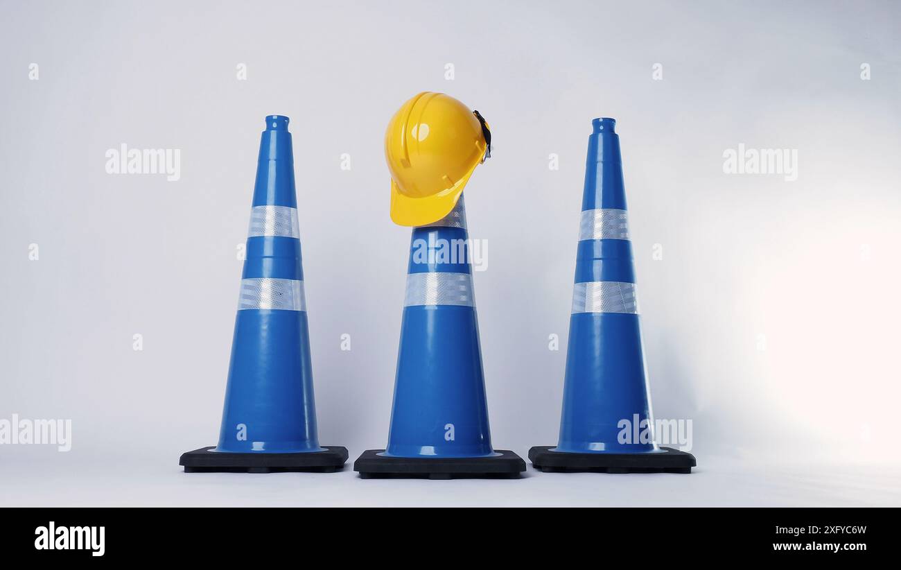 Road traffic safety equipment. Realistic blue traffic cones and yellow ...