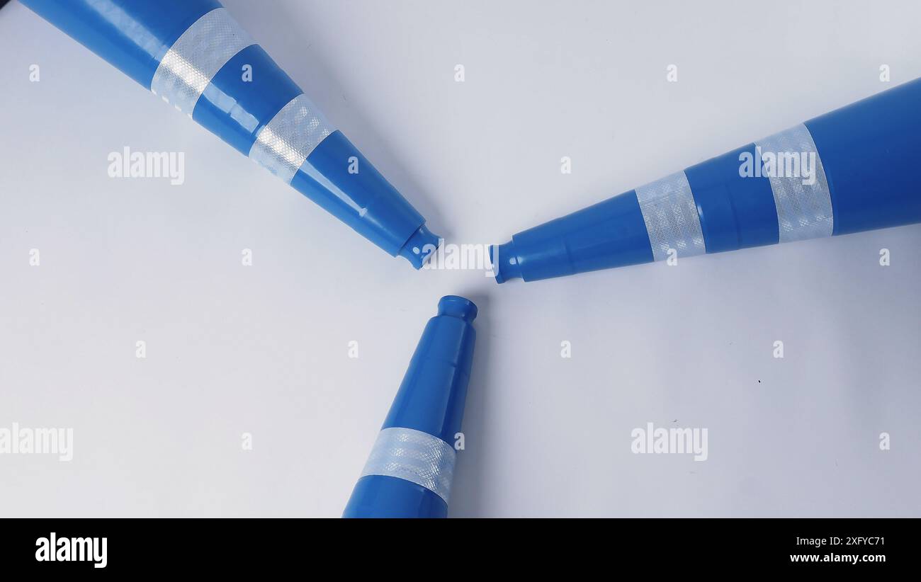 Road traffic safety equipment. Realistic blue traffic cones and yellow ...