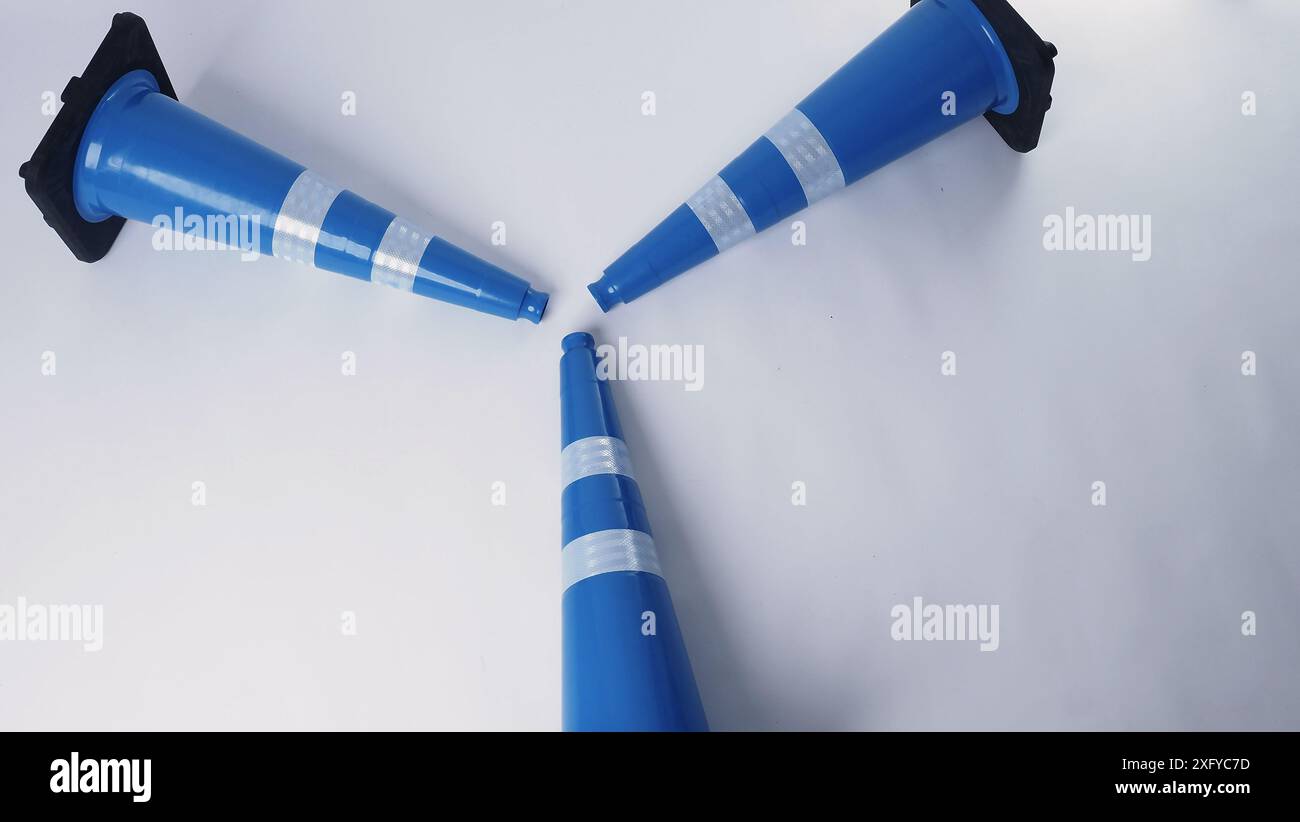 Road traffic safety equipment. Realistic blue traffic cones and yellow ...