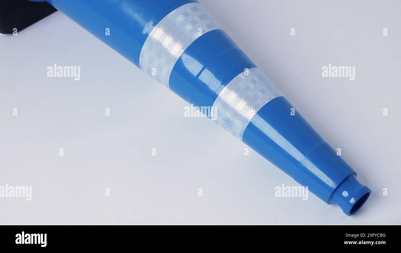 Road traffic safety equipment. Realistic blue traffic cones and yellow ...