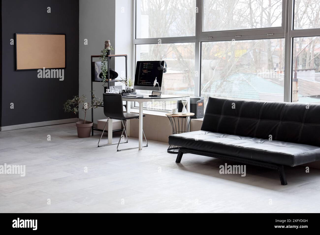 Interior of modern office with programmer's desk and couch Stock Photo ...