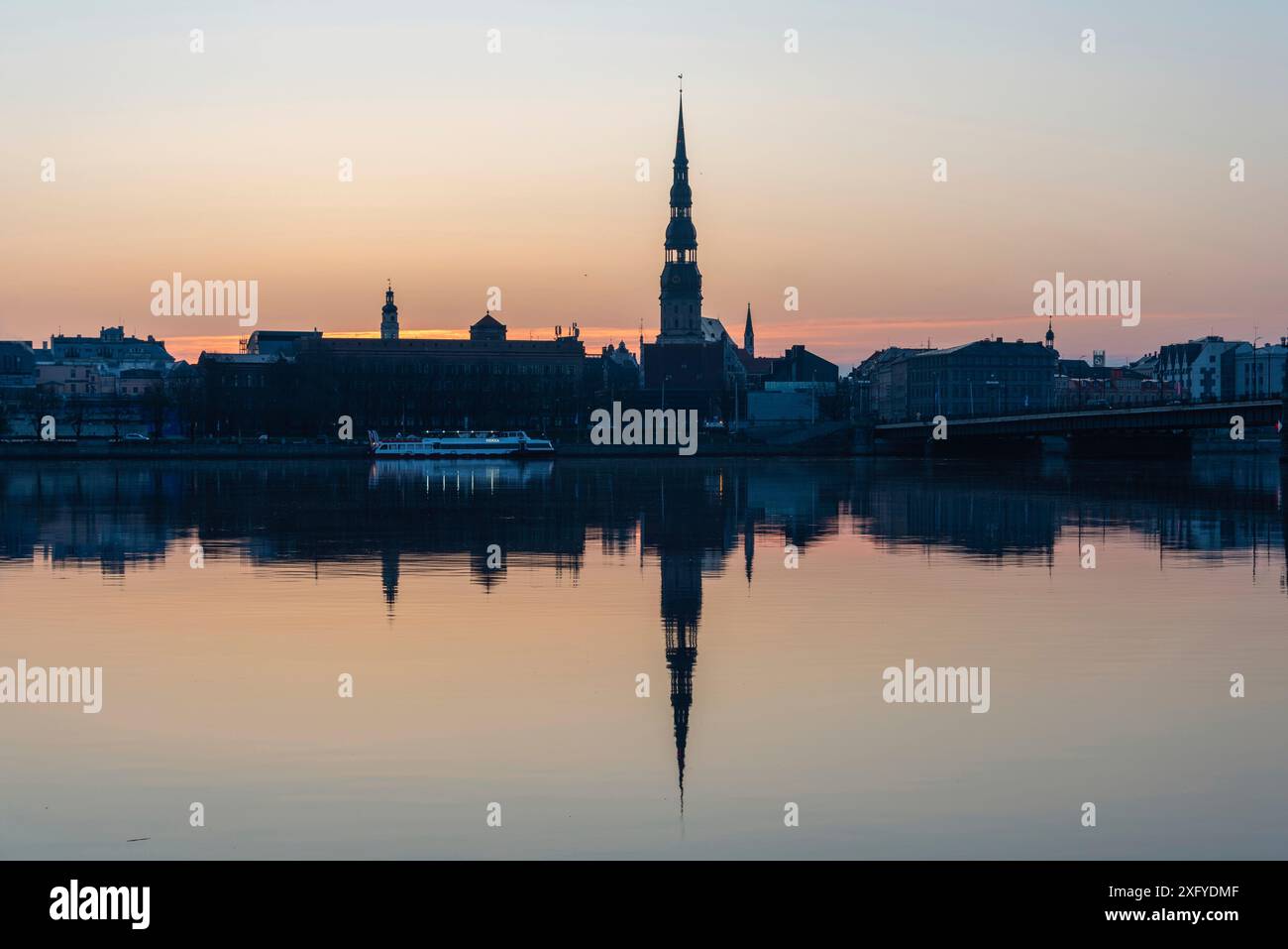 Sunrise on the daugava river with st peters church hi-res stock ...