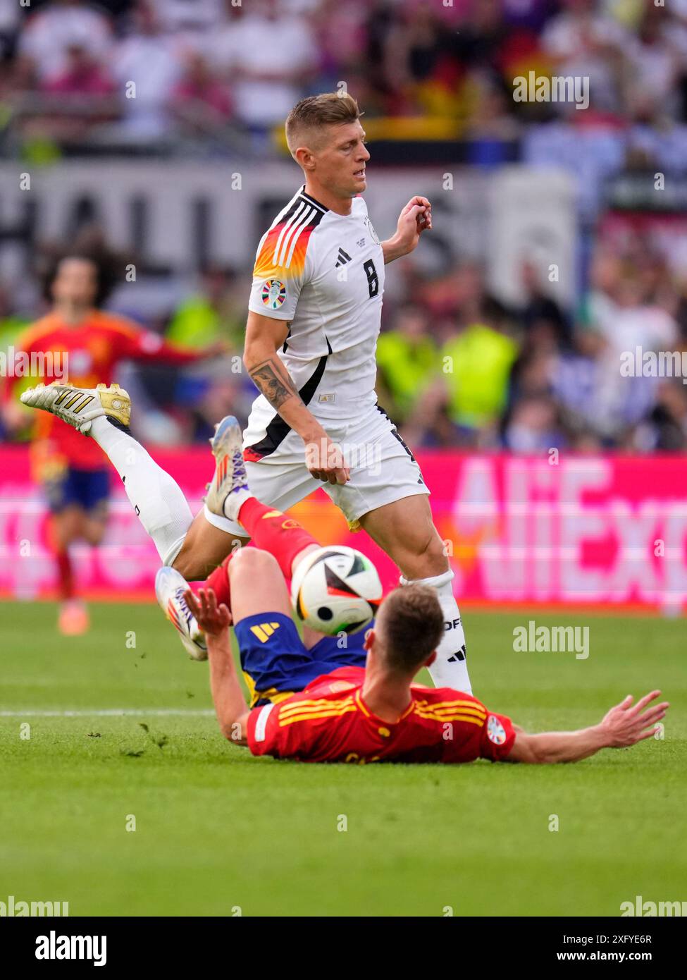 Germany's Toni Kroos, back, fouls Spain's Dani Olmo during a quarter ...