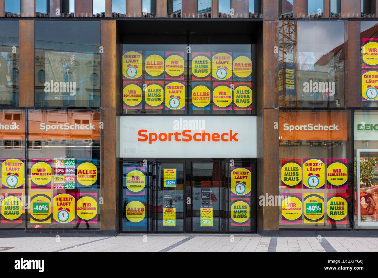 Entrance to the Sport Scheck store in Munich city center with the ...