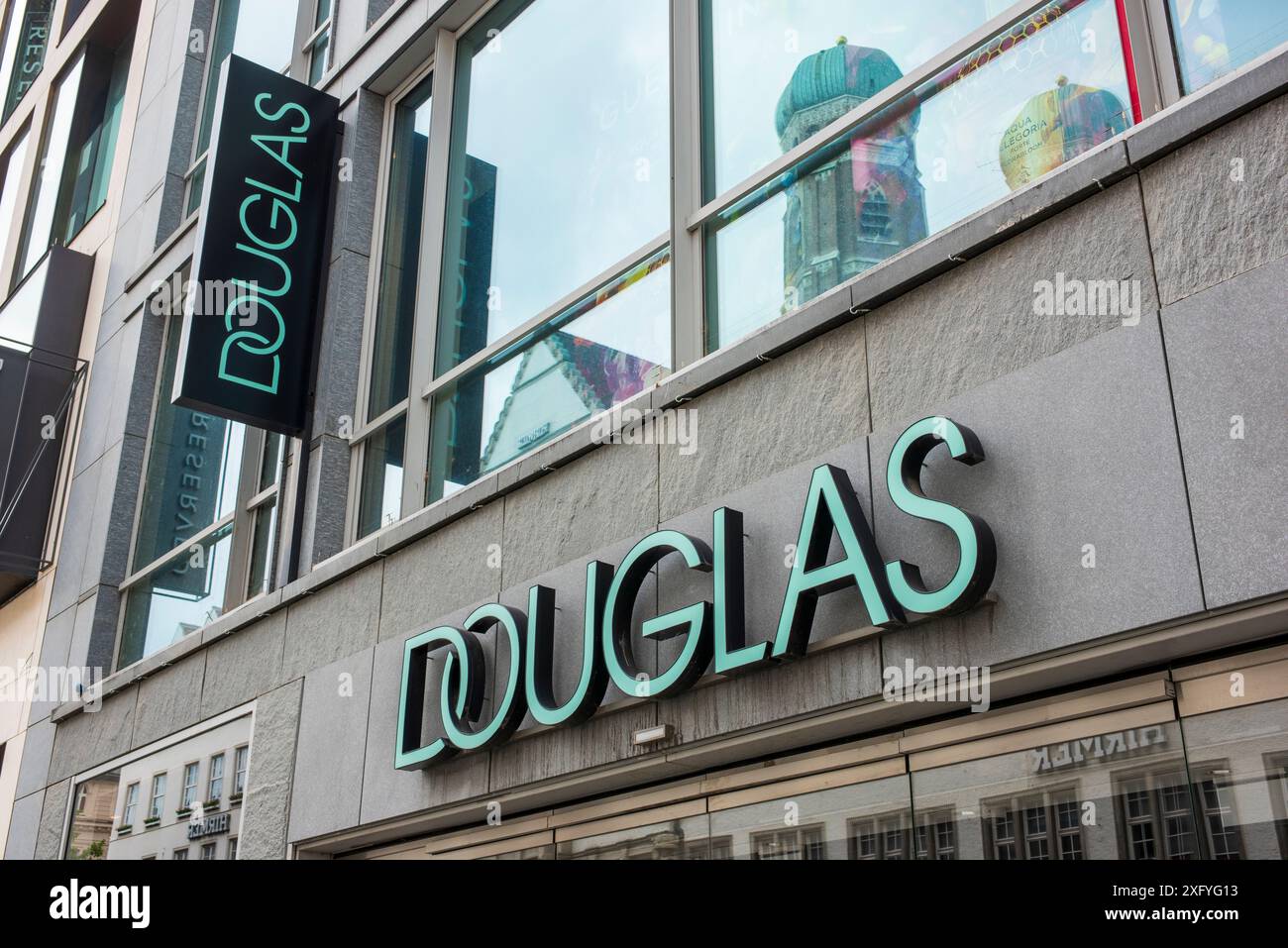 Logo of the Douglas company above its store in Munich's pedestrian zone ...