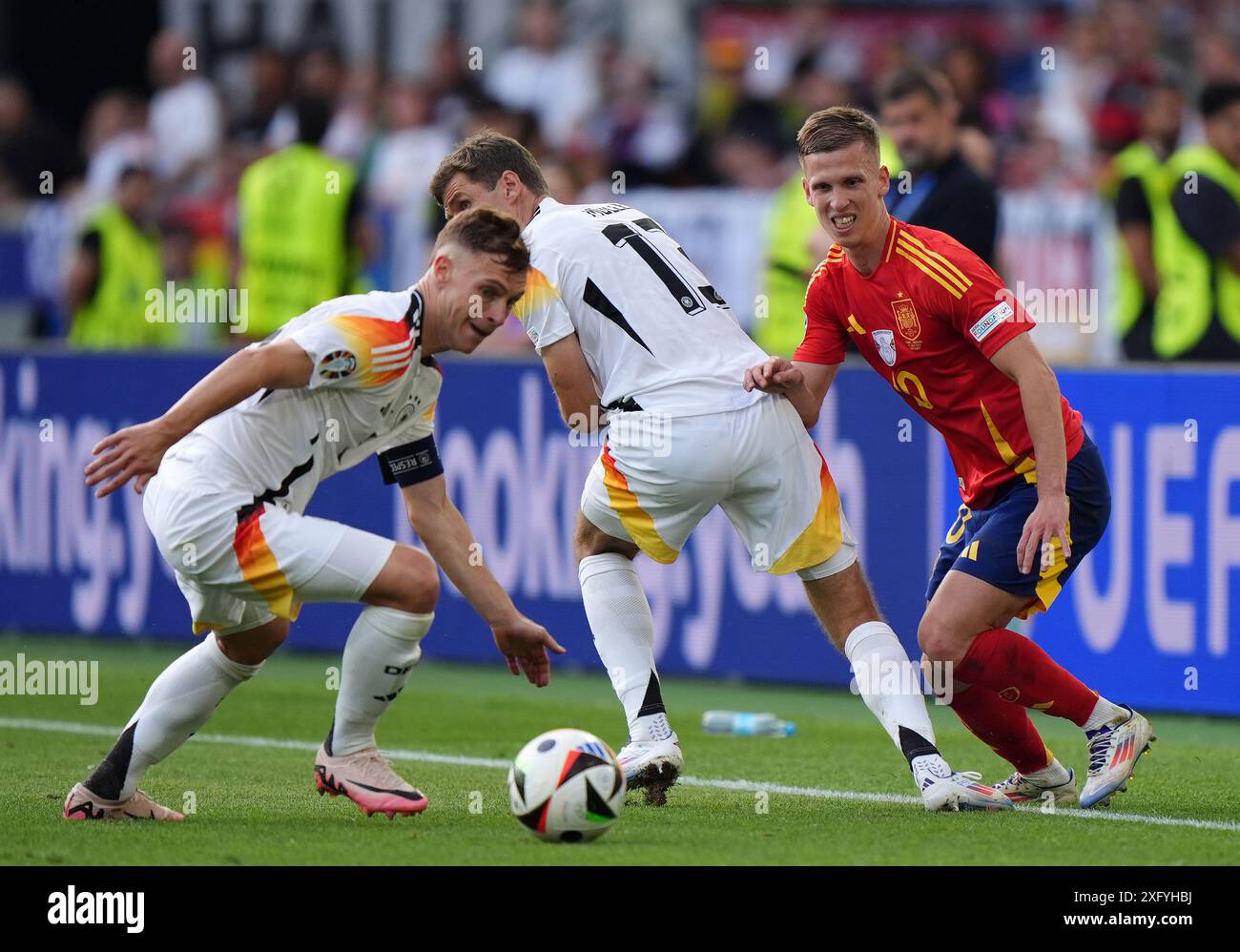 Spain’s Dani Olmo in action against Germany’s Thomas Muller (centre ...