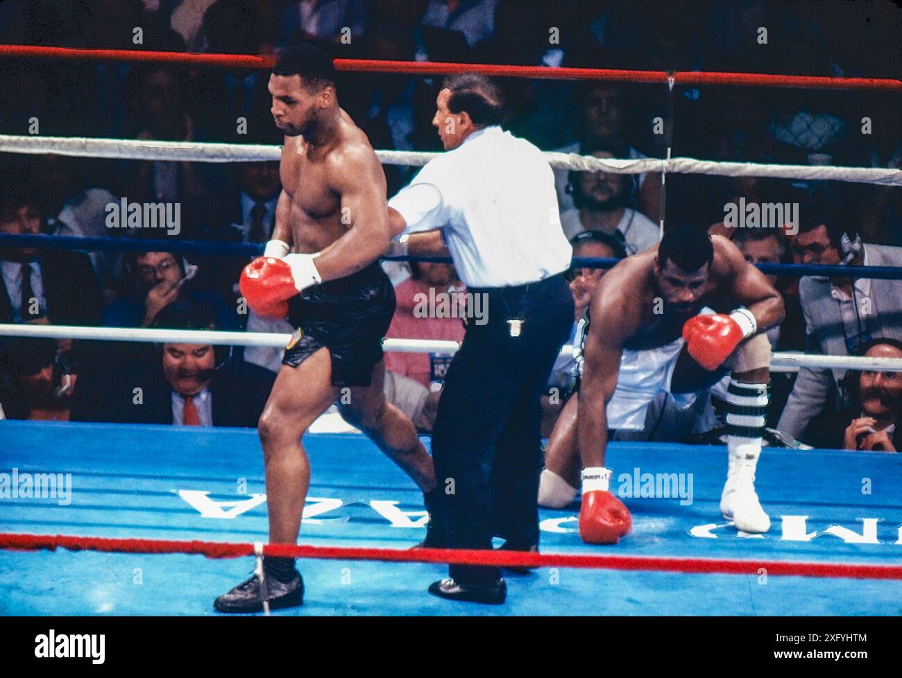 Mike Tyson knocks out Michael Spinks in the first round of their ...