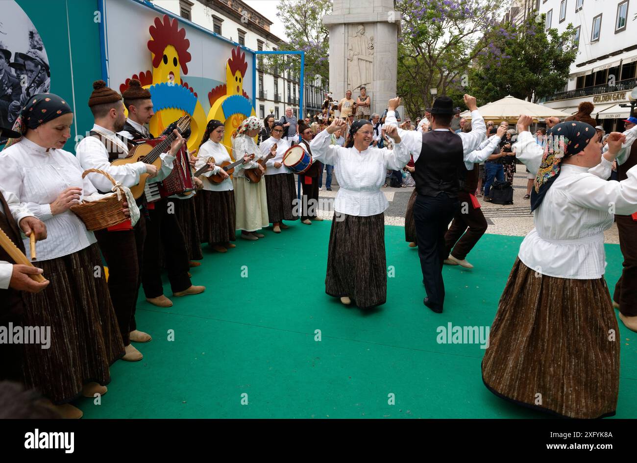 Folk dance group in the pedestrian zone (Avenida Arriaga) of the old ...