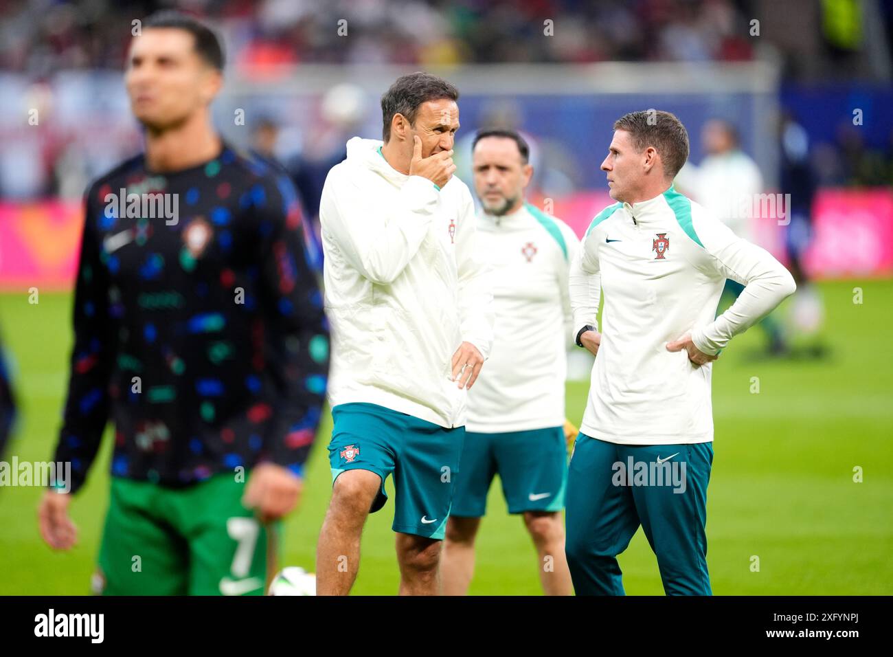 Portugal assistant coaches Ricardo Carvalho (centre) speaks with ...