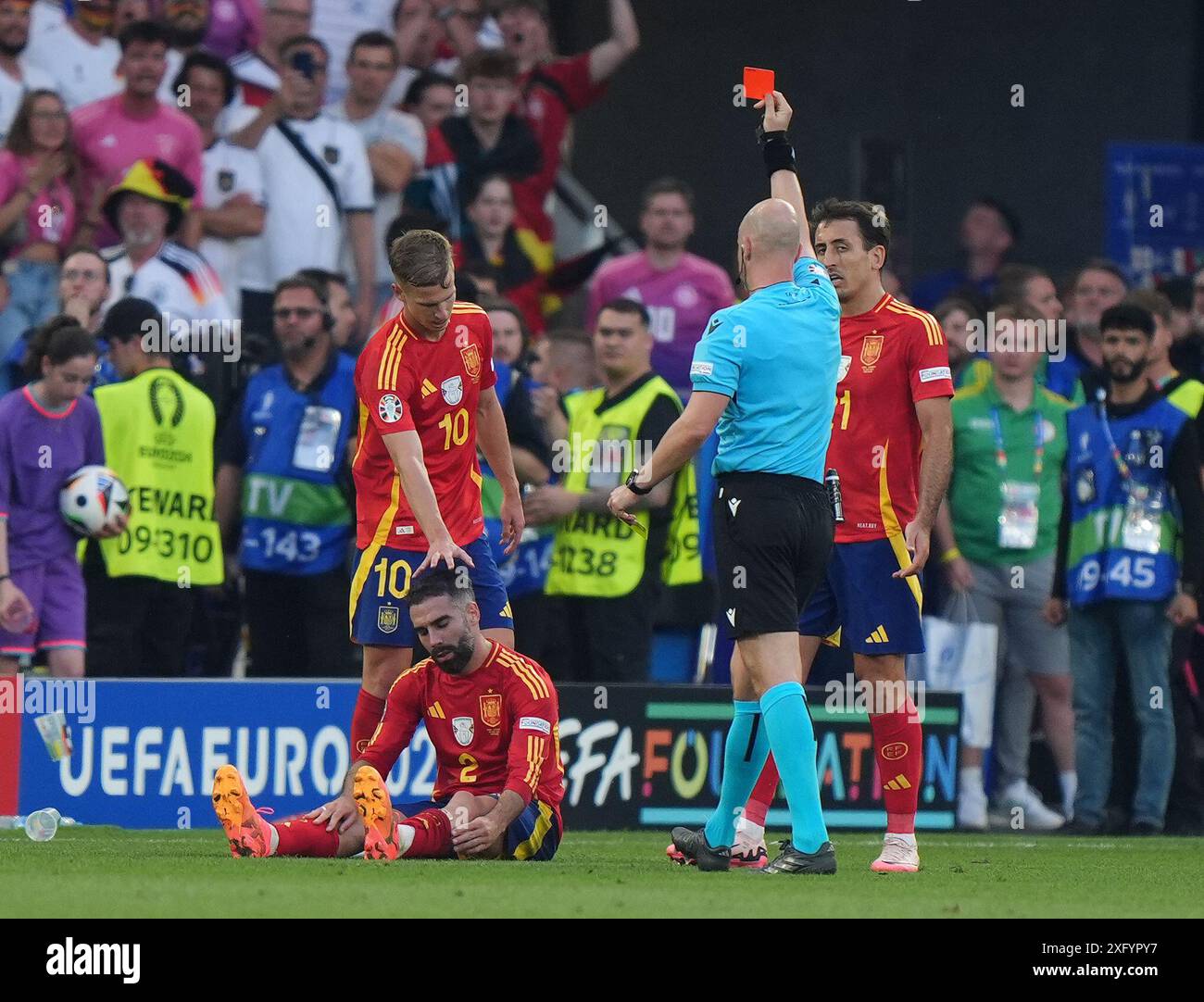 Spain’s Daniel Carvajal is shown a red card by referee Anthony Taylor ...