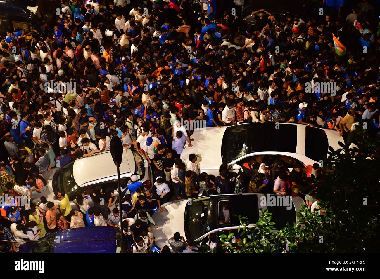 MUMBAI, INDIA - JULY 4: Indian cricketers gesture during an open bus ...