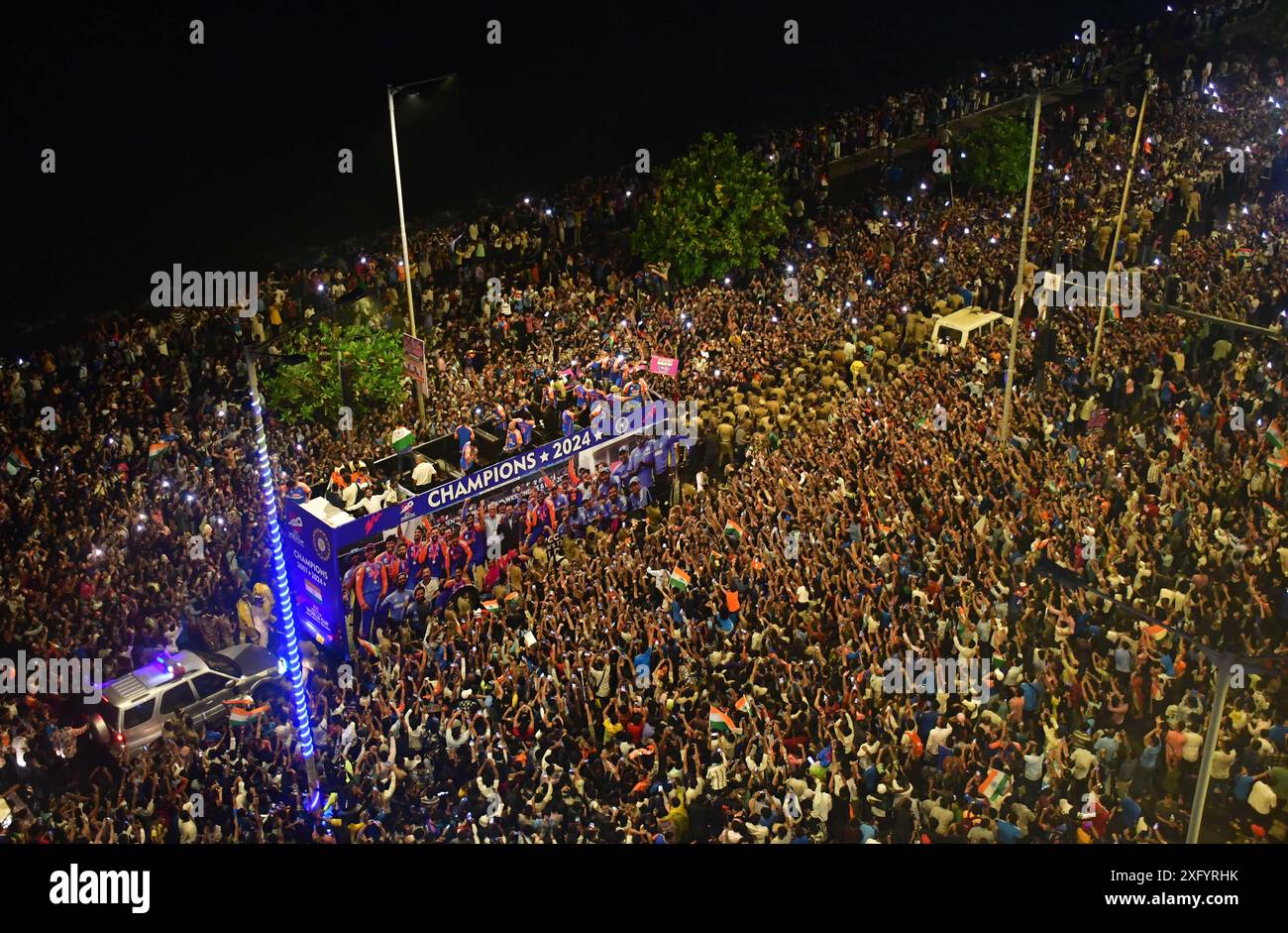 MUMBAI, INDIA - JULY 4: Indian cricketers gesture during an open bus ...