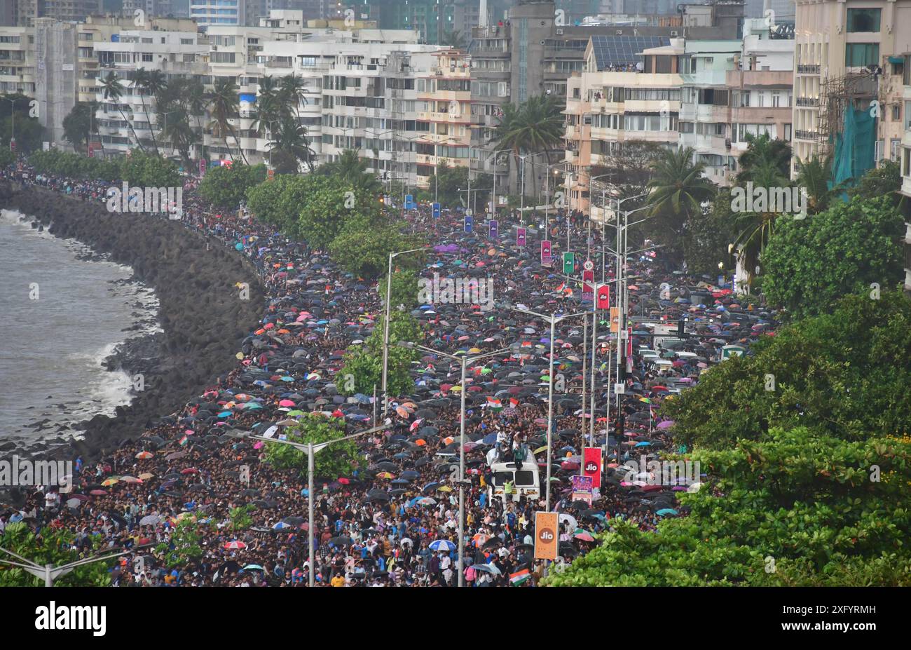 MUMBAI, INDIA - JULY 4: Indian cricketers gesture during an open bus ...