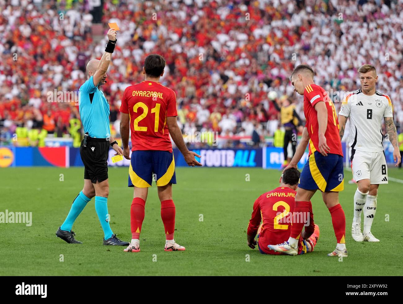 Spain's Daniel Carvajal is shown a red card for a second booking after ...