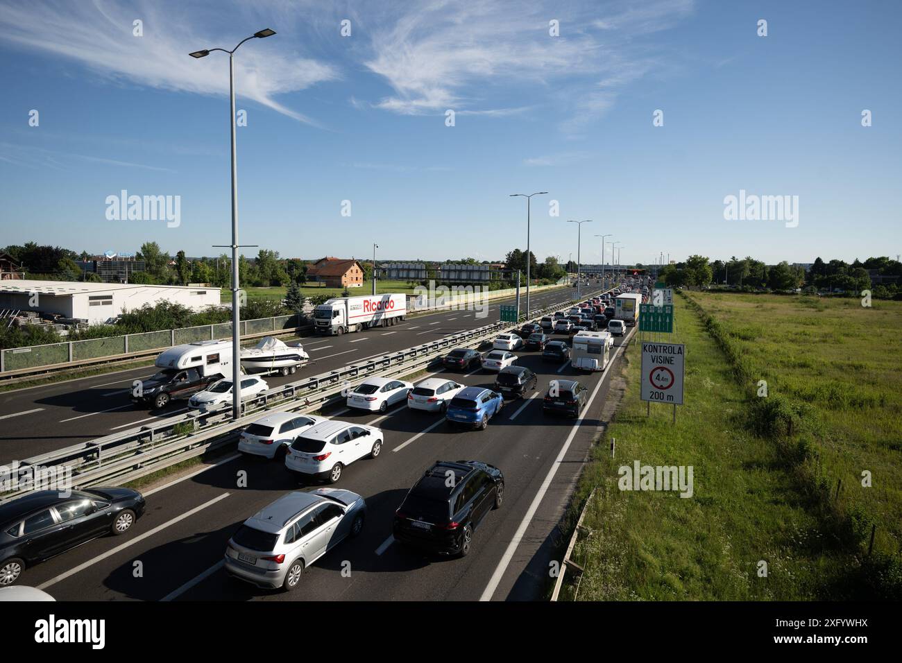 Zagreb, Croatia. 05th July, 2024. Cars form a queue at a toll station ...