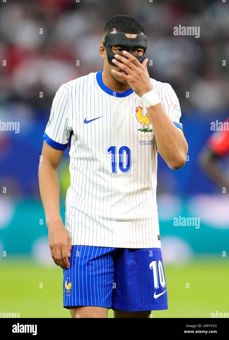 France's Kylian Mbappe with a protective mask on during the UEFA Euro ...