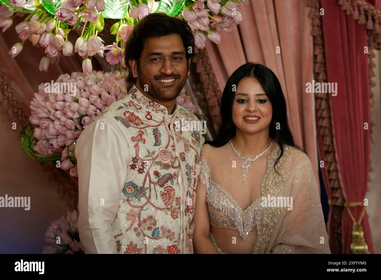 Indian cricketer Mahendra Singh Dhoni with wife Sakshi pose for a ...