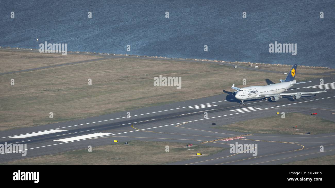 A Lufthansa Boeing 747 preparing for takeoff on a runway in Boston ...