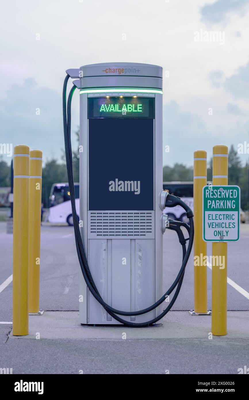 An electric vehicle charging station with available status in a parking ...