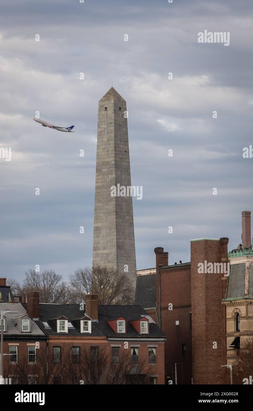A view of the Bunker Hill Monument with an airplane taking off in the ...