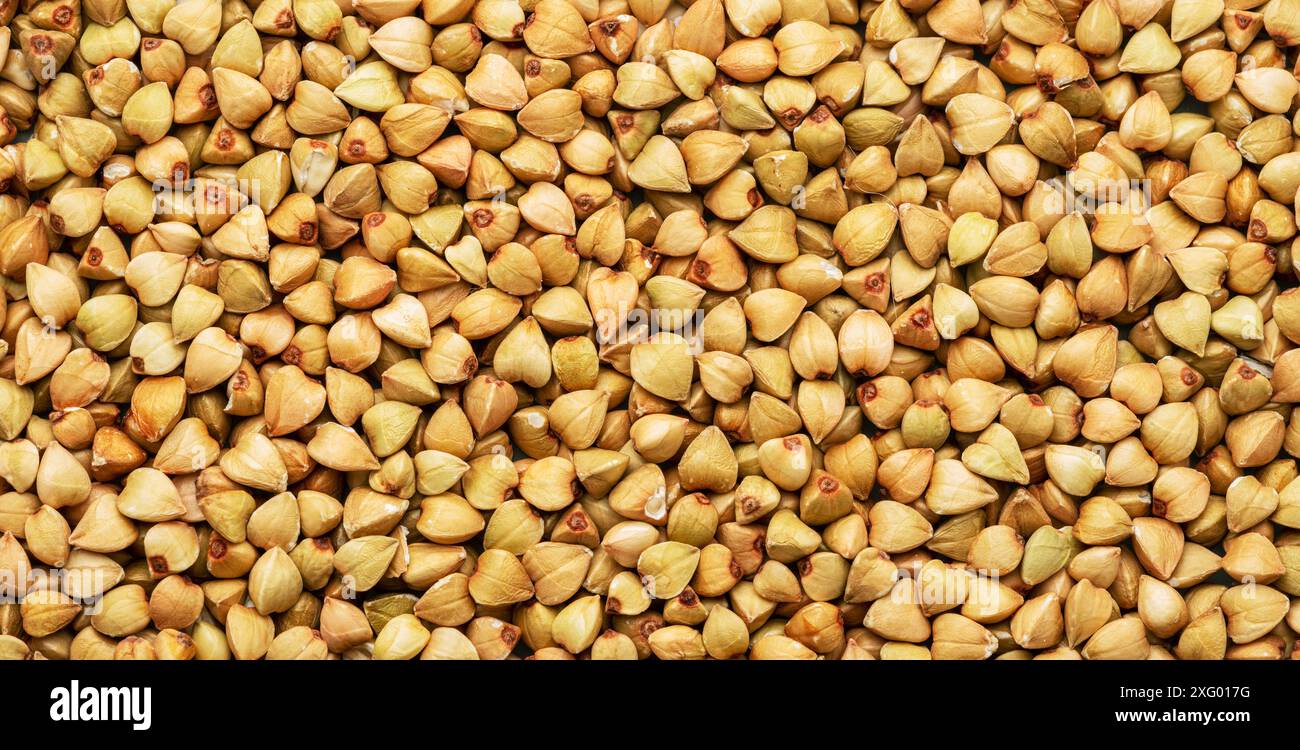 Hulled kernels of buckwheat grains close up. Food background Stock ...
