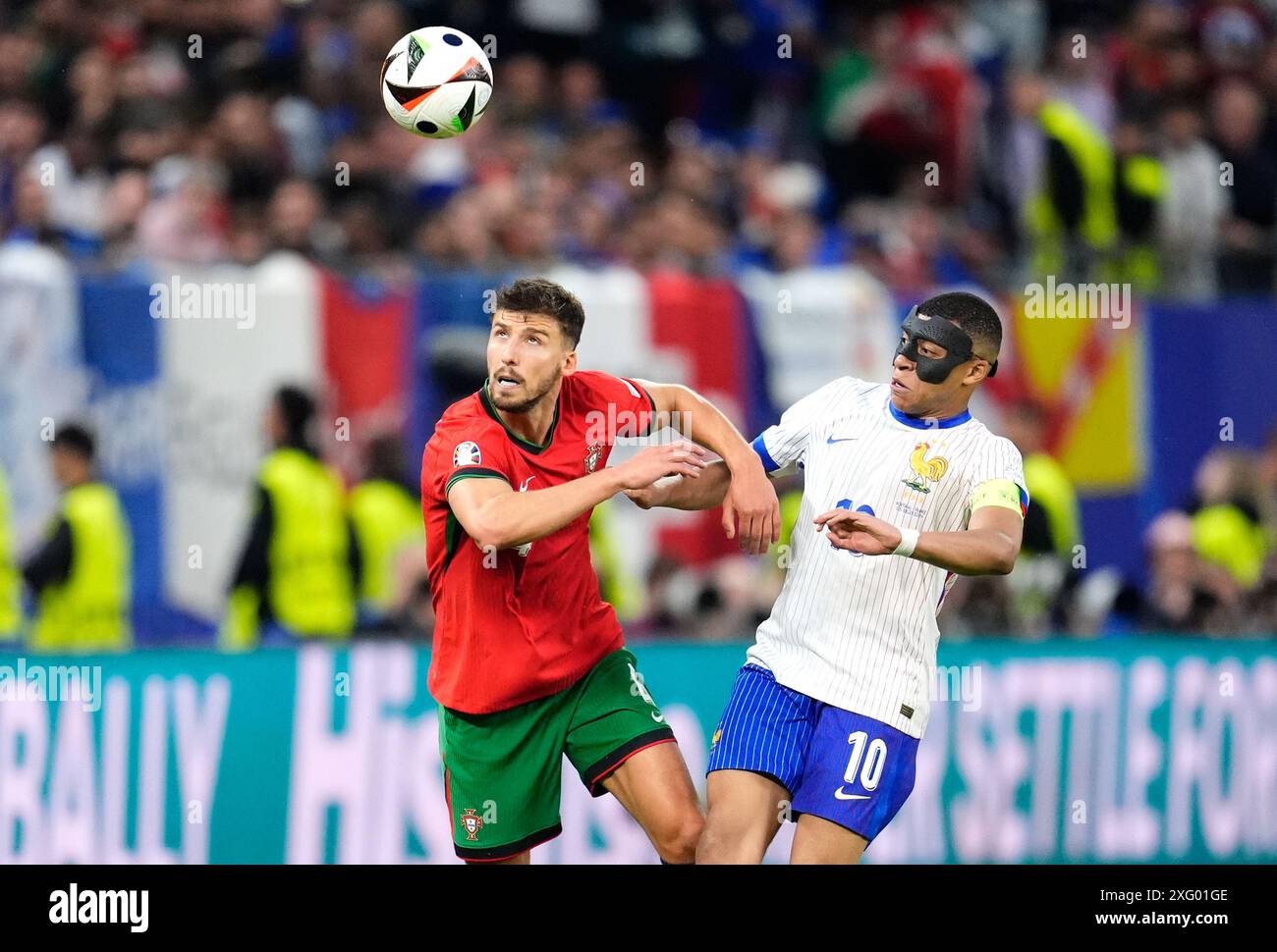 France's Kylian Mbappe (right) and Portugal's Ruben Dias during the ...