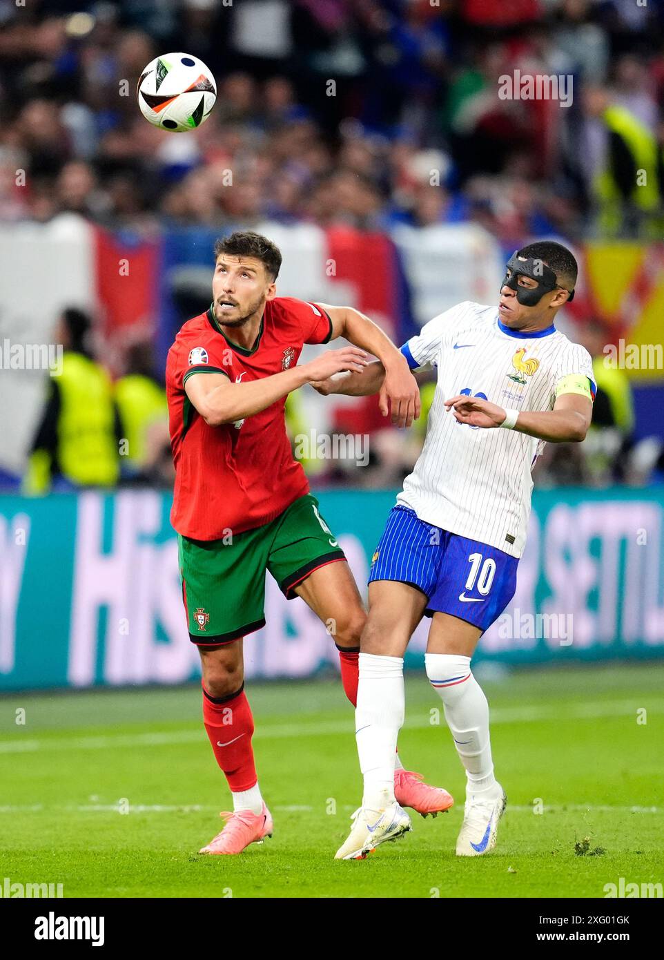France's Kylian Mbappe (right) and Portugal's Ruben Dias during the ...