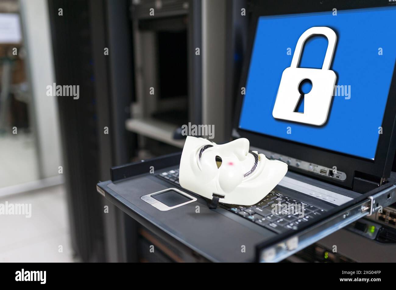Masked Hacker in Computer Server room Concept .Editorial photo Stock ...