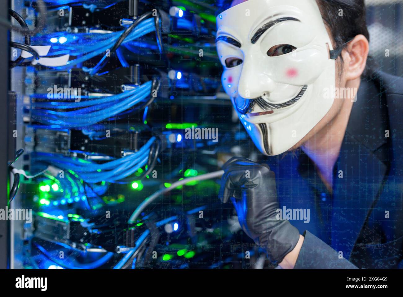 Masked Hacker in Computer Server room Concept .Editorial photo Stock Photo - Alamy