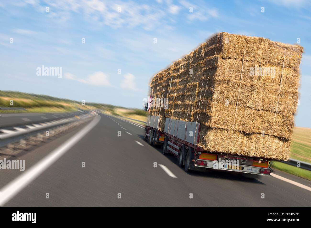 Straw transport by truck on the freeway, help after heatwave and ...