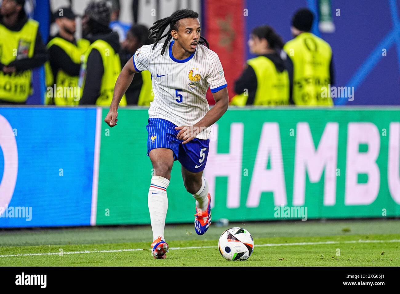 Hamburg, Germany. 05th July, 2024. Jules Kounde of France dribbles ...