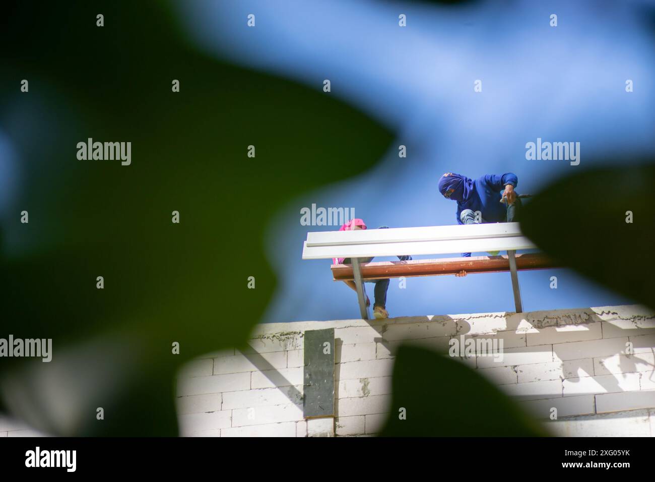 Working at heights without protective equipment Stock Photo - Alamy