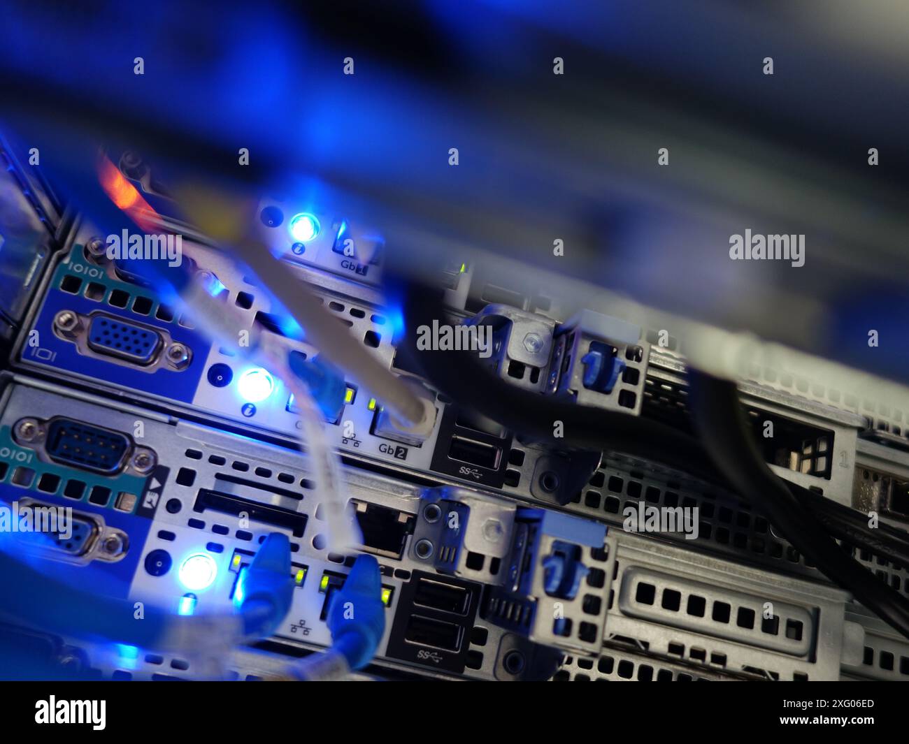 close up of network cables connected to server racks in data center ...