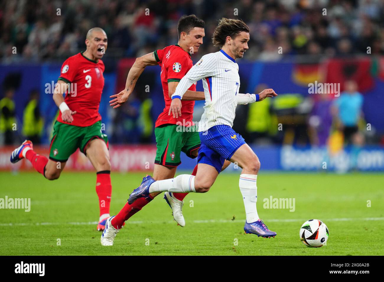 Joao Palinha of Portugal and Antonie Griezmann of France during the UEFA Euro 2024 match between ...