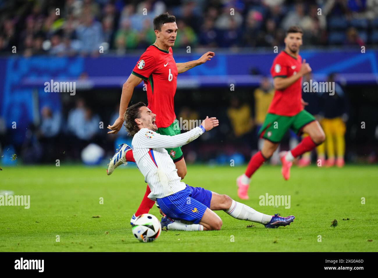Joao Palinha of Portugal and Antonie Griezmann of France during the UEFA Euro 2024 match between ...