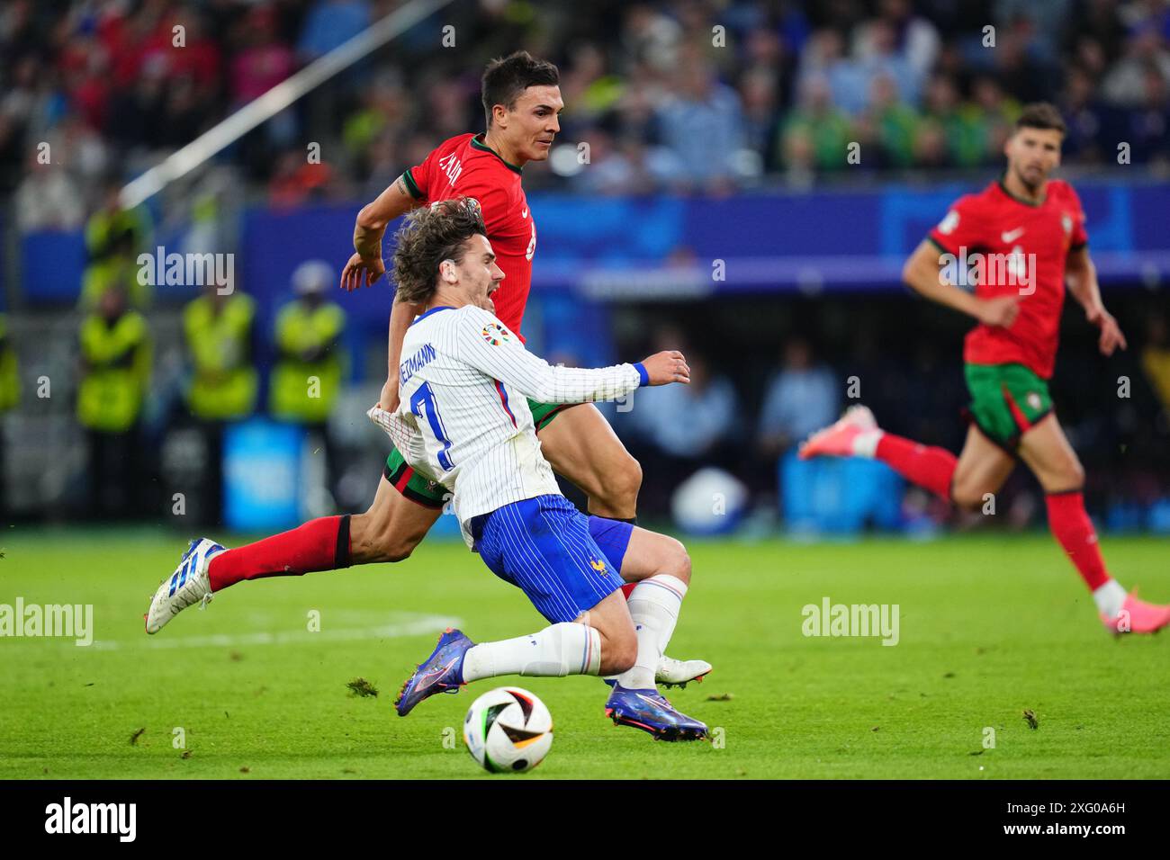 Joao Palinha of Portugal and Antonie Griezmann of France during the UEFA Euro 2024 match between ...