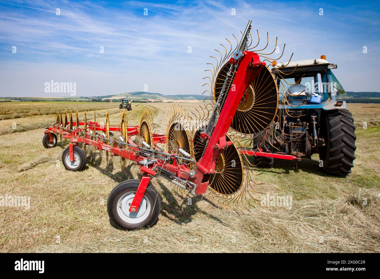 Hay swathing with a wide sun rake, haymaking, France Stock Photo - Alamy