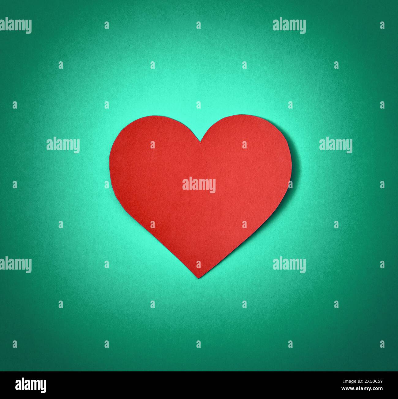 Healthy life with red heart-shaped cutout in the center on green ...