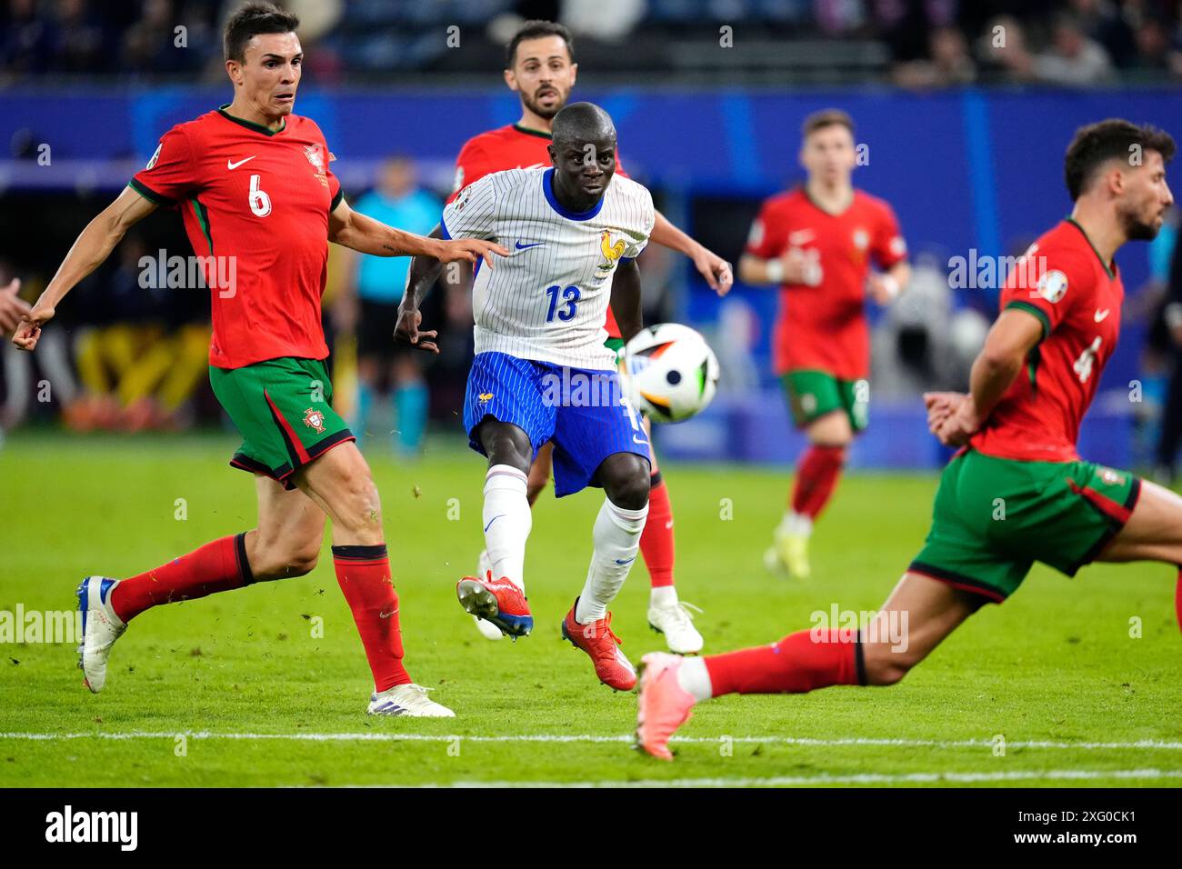 France's Ngolo Kante (centre) attempts a shot towards goal during the ...