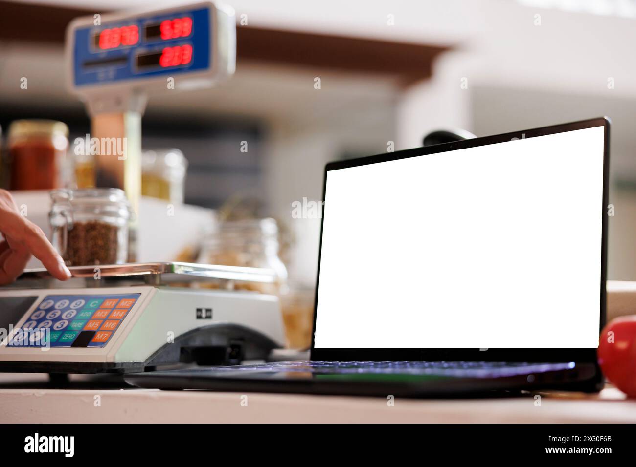Close-up of laptop at cashier desk, showing isolated chromakey ...