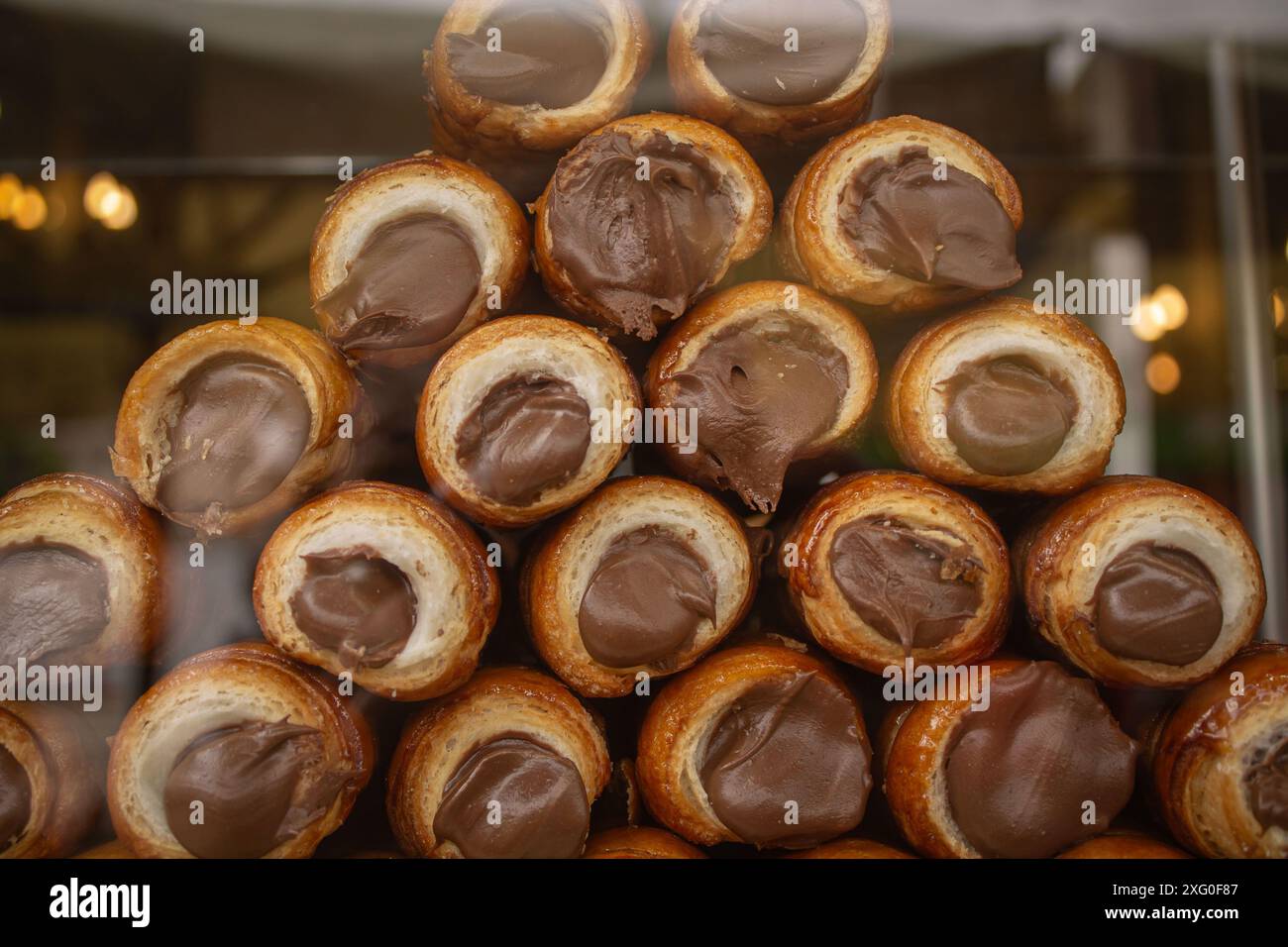 Italian sweet rolls with chocolate cream in Milan. Sicilian canolli ...