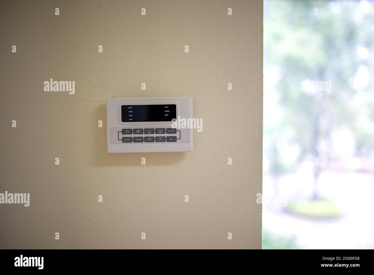 Close-up of air condition keypad on the wall Stock Photo - Alamy