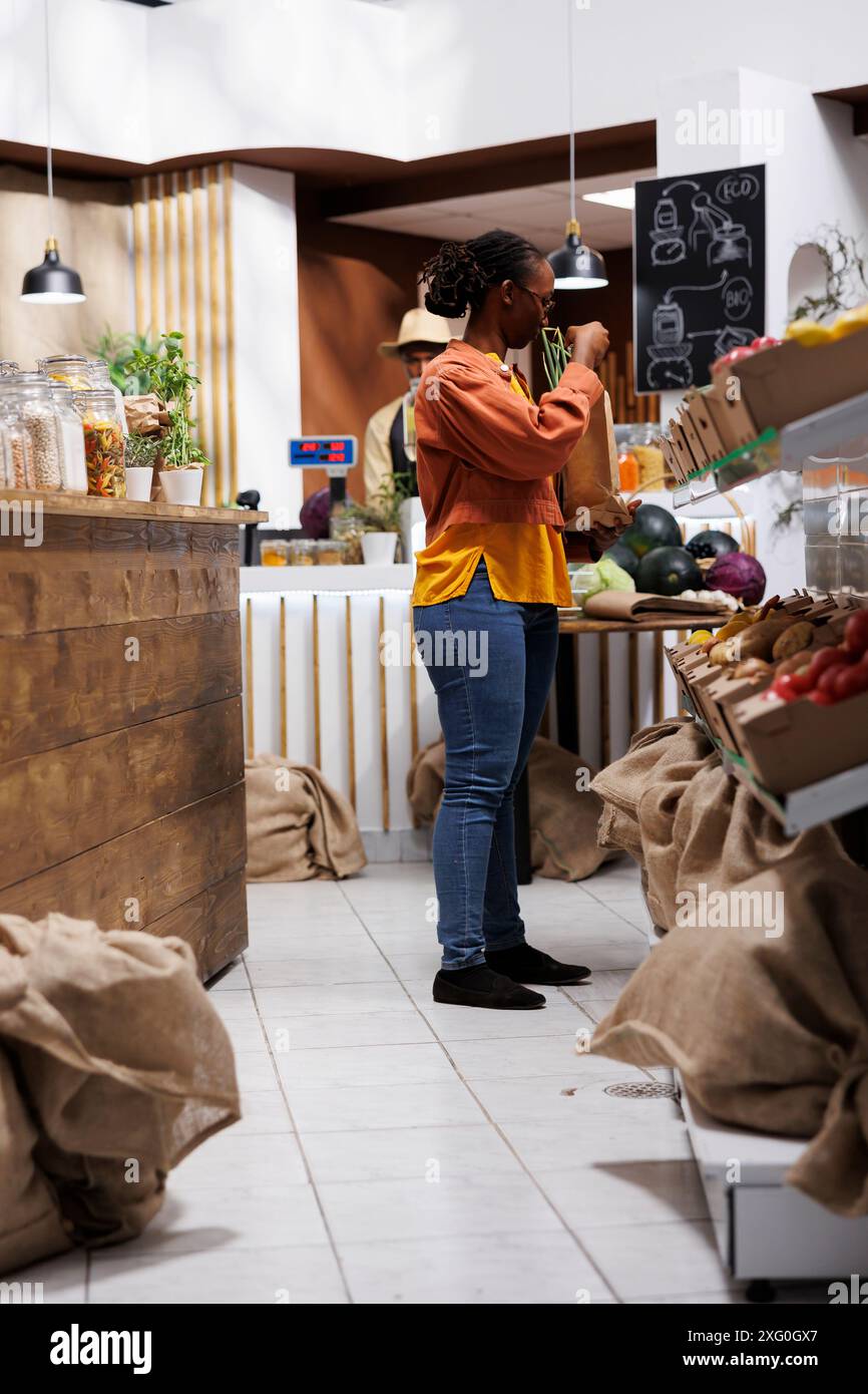 Black lady shops for eco friendly, sustainable products at a modern ...