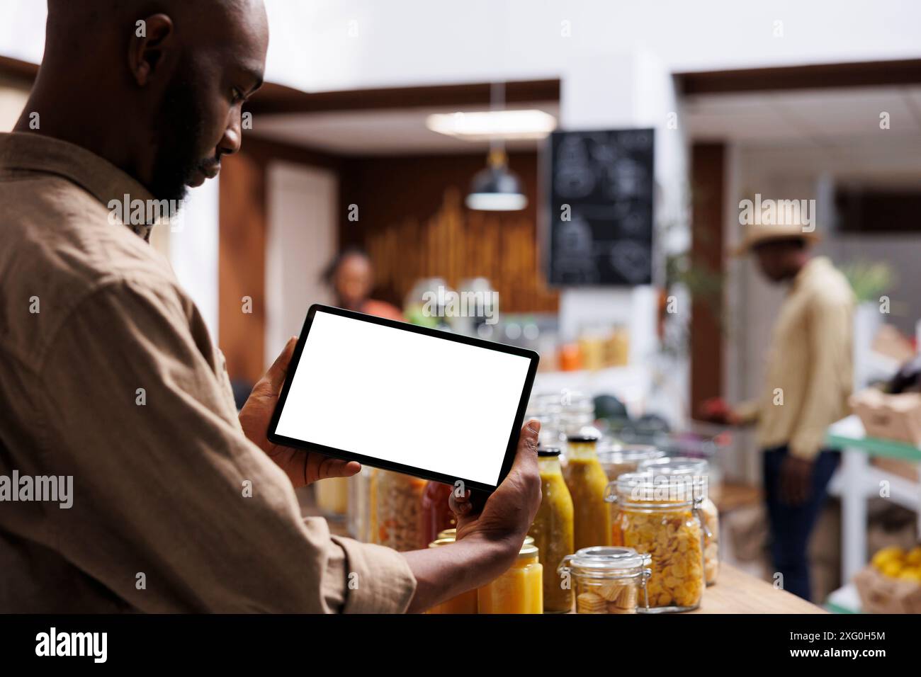 Man holds tablet green screen hi-res stock photography and images - Alamy
